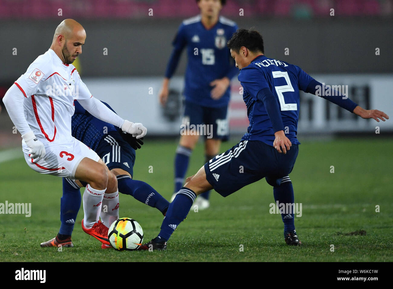 So Fujitani of Japan, right, challenges Mohammed Rashid of Palestine in ...