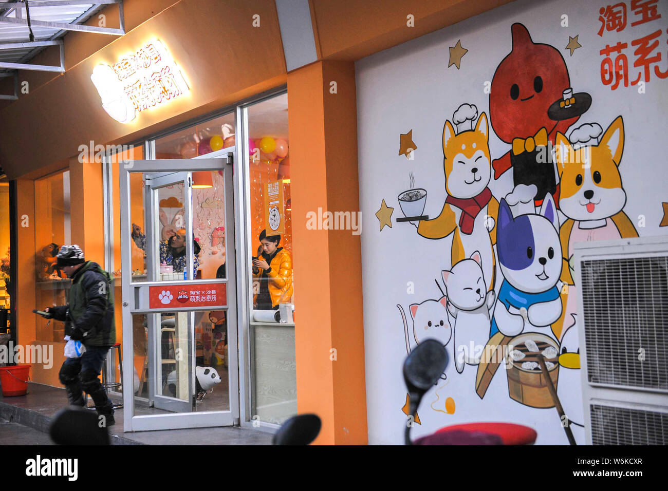 A customer leaves one of the Shaxian Delicacies restaurant in cute ...