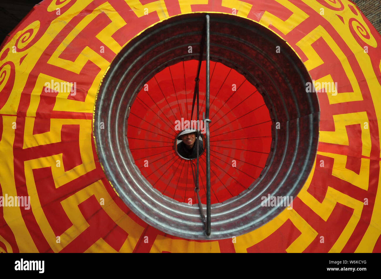 A Chinese worker makes red lanterns for the upcoming Spring Festival or ...