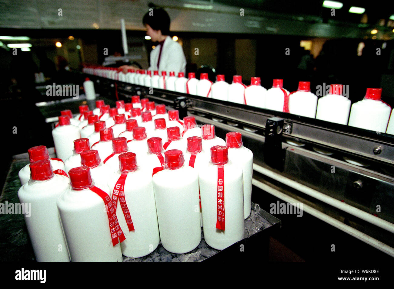 Bottles of Kweichow Moutai liquor are being packaged in a Moutai ...