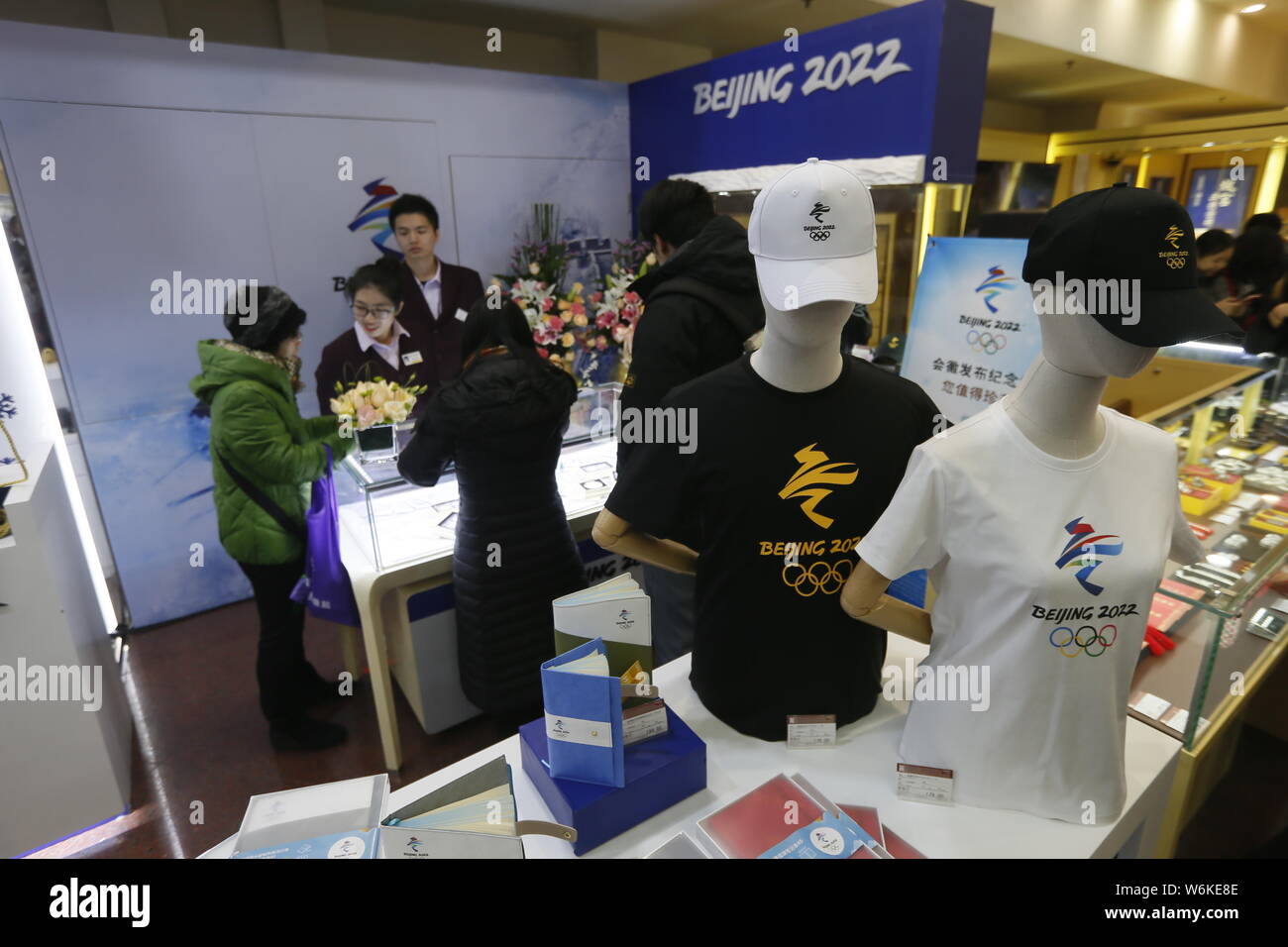 Chinese customers shop for souvenirs at one of the first batch of ...
