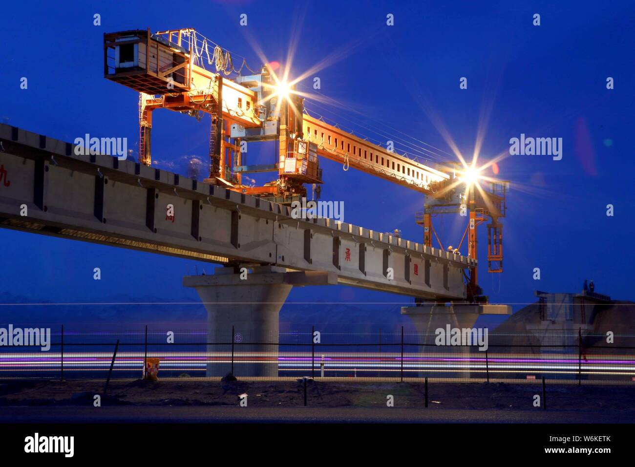 Chinese construction workers build a viaduct for the Ha'e (Hami-Ejina ...