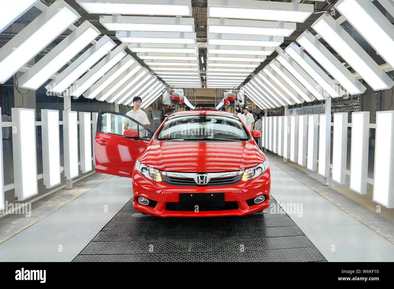 --FILE--A car is being manufactured on the assembly line at an auto ...