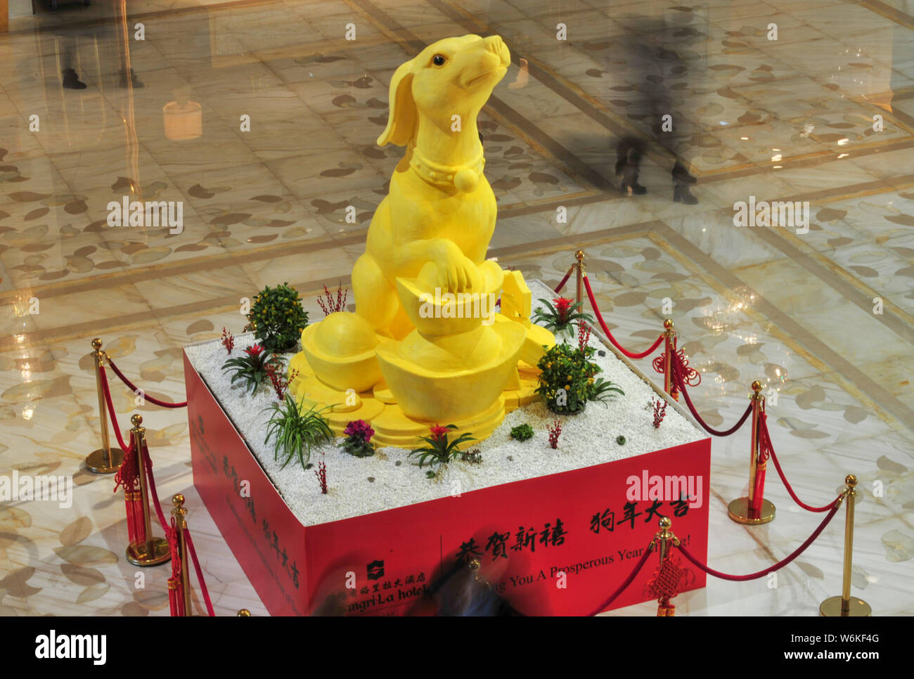 A dog-shaped butter statue created to mark the Chinese New Year in 2018 ...
