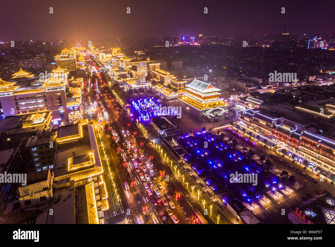 Aerial view of the Bell Tower, buildings and streets at night in Xi'an ...