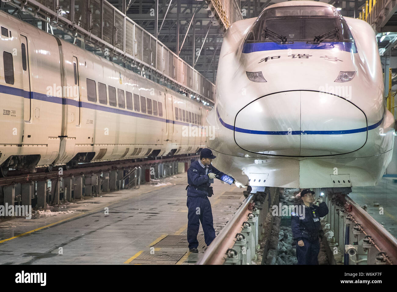 Chinese workers check a CRH (China Railway High-speed) bullet train for the Spring Festival ...