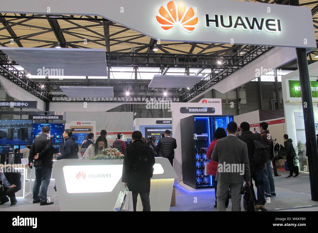 --FILE--People visit the stand of Huawei during an exhibition in ...