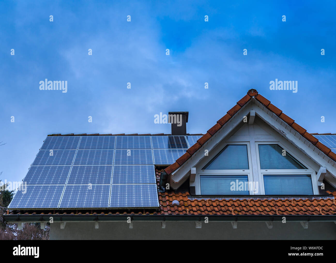 Red tile house roof coveredy by solar panels Stock Photo - Alamy