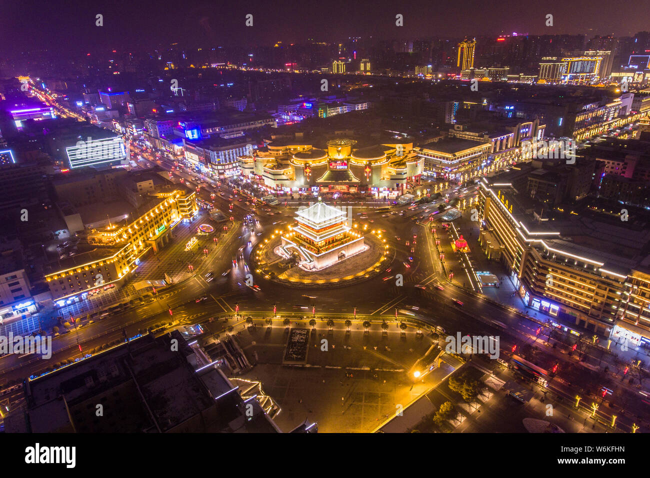 Aerial view of the Bell Tower, buildings and streets at night in Xi'an ...