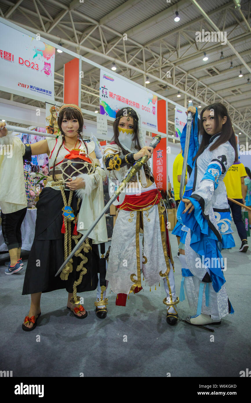 --FILE--Chinese cosers dressed in cosplay costumes pose during the 6th ...