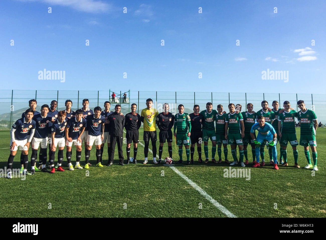 Players of China's Beijing Renhe F.C. pose for photos during the winter ...