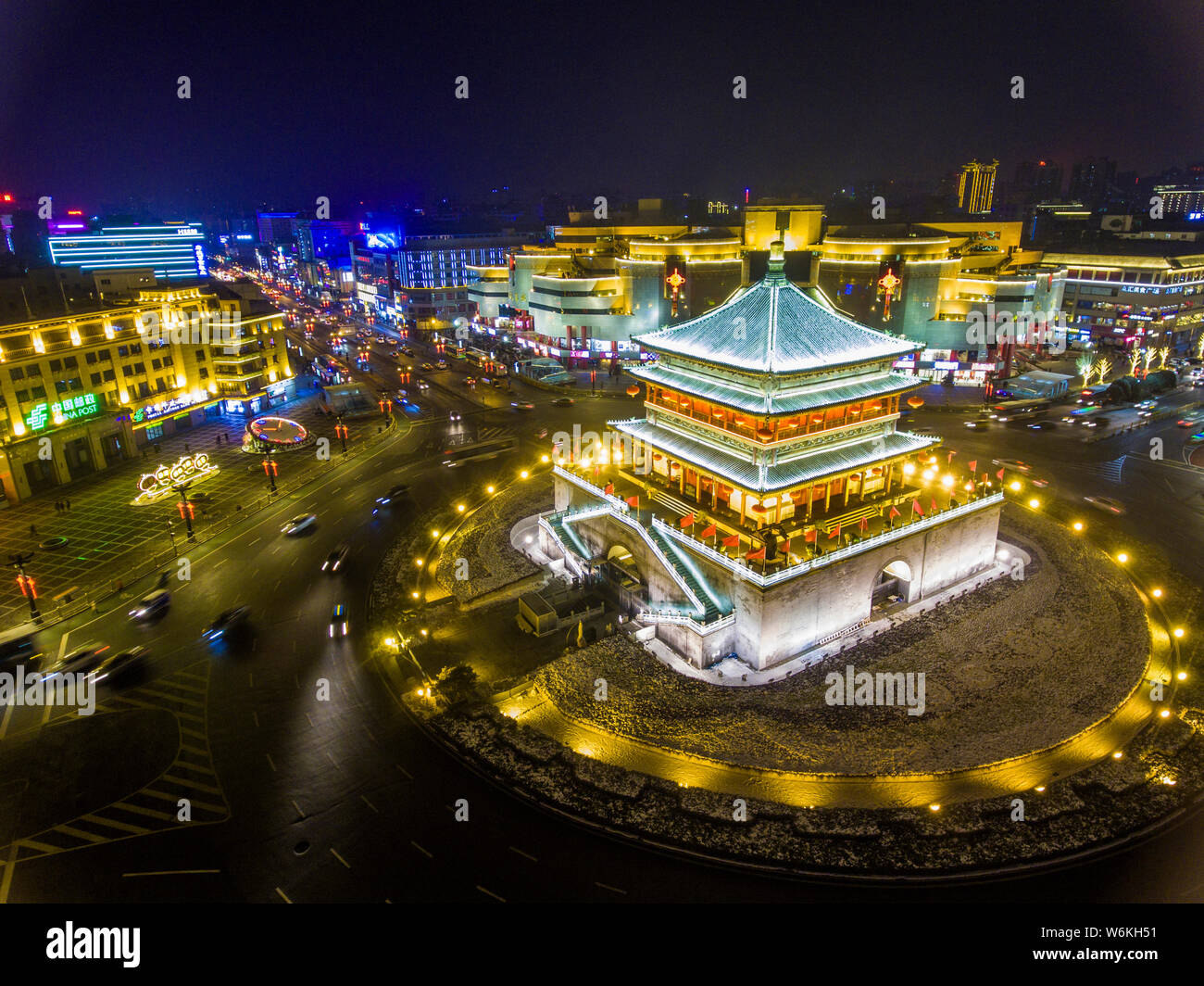 Aerial view of the Bell Tower, buildings and streets at night in Xi'an ...