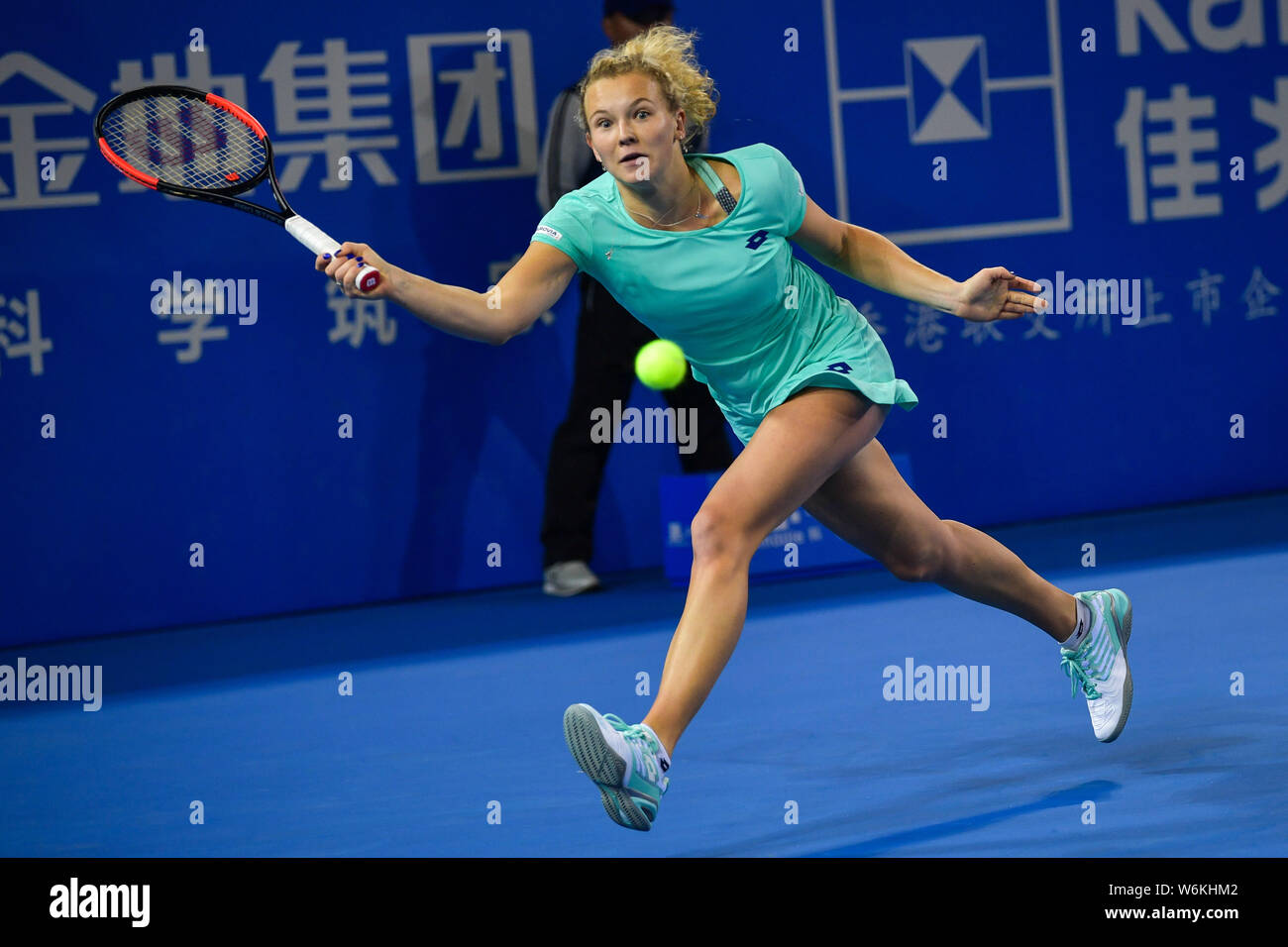 Katerina Siniakova of Czech Republic returns a shot to Maria Sharapova ...