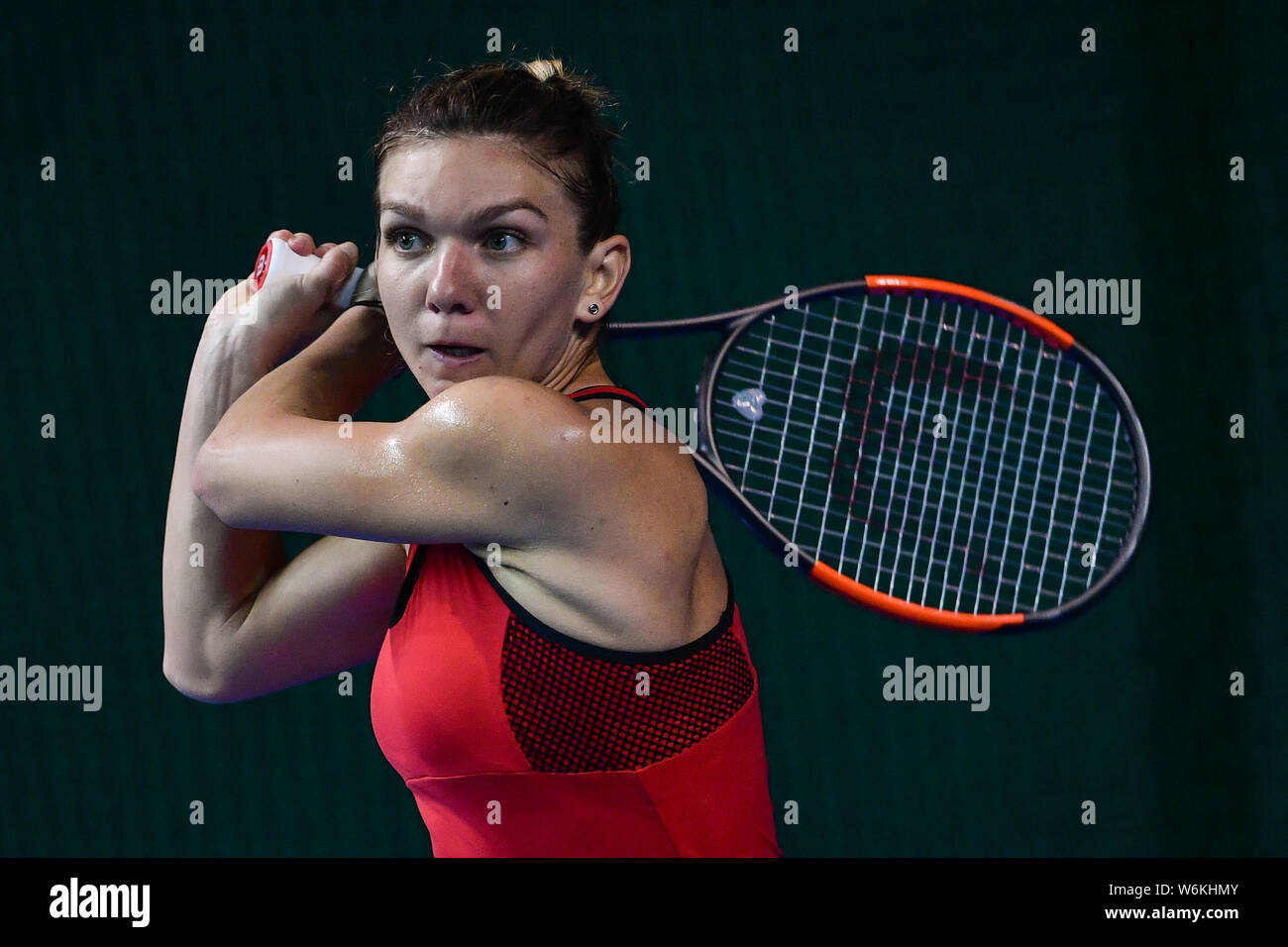 Simona Halep of Romania returns a shot to Katerina Siniakova of Czech ...