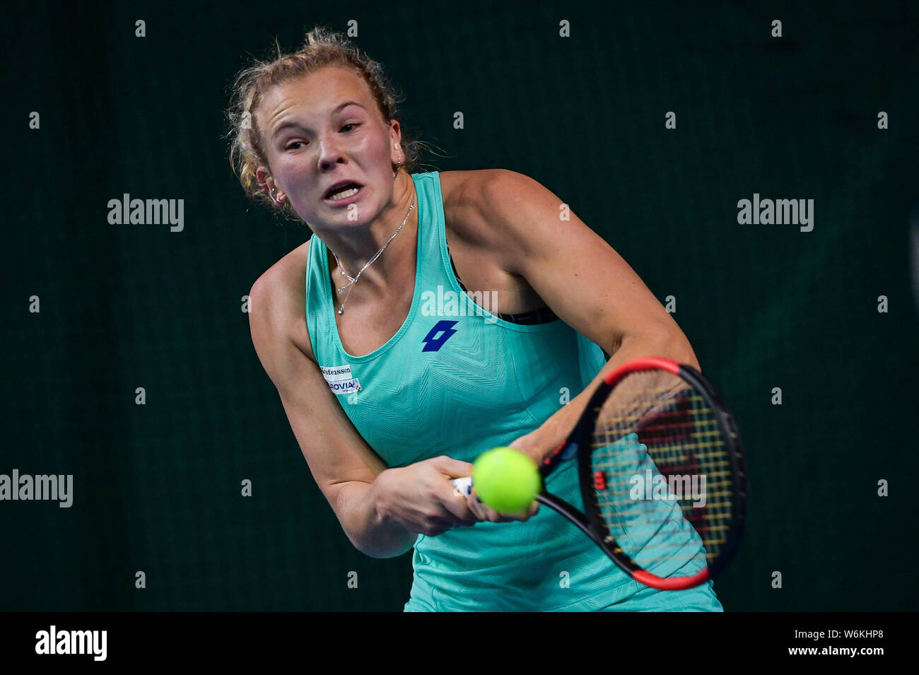 Katerina Siniakova of Czech Republic returns a shot to Simona Halep of ...