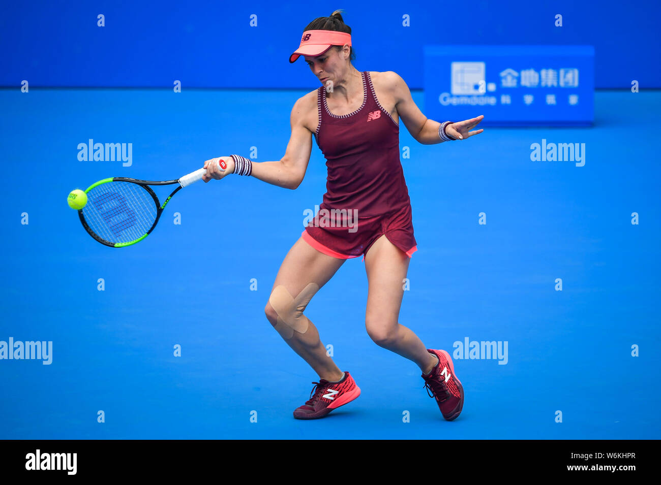 Nicole Gibbs of the United States returns a shot to Simona Halep of ...