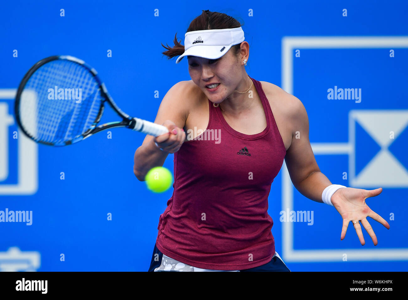 Duan Yingying of China returns a shot to Simona Halep of Romania in ...