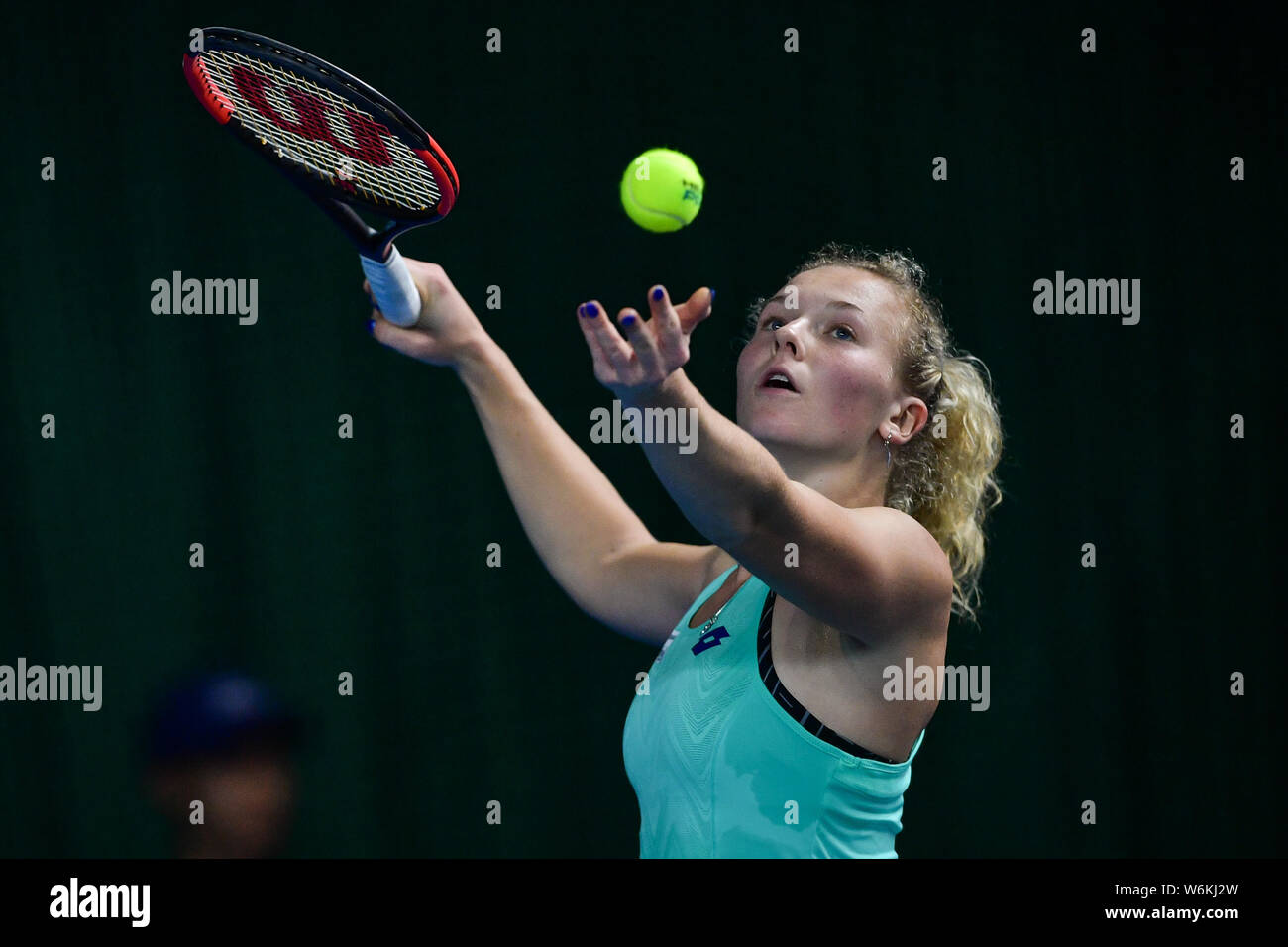 Katerina Siniakova of Czech Republic serves against Simona Halep of ...