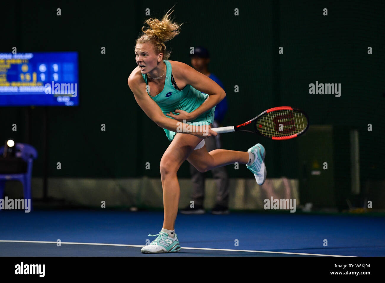Katerina Siniakova of Czech Republic serves against Simona Halep of ...