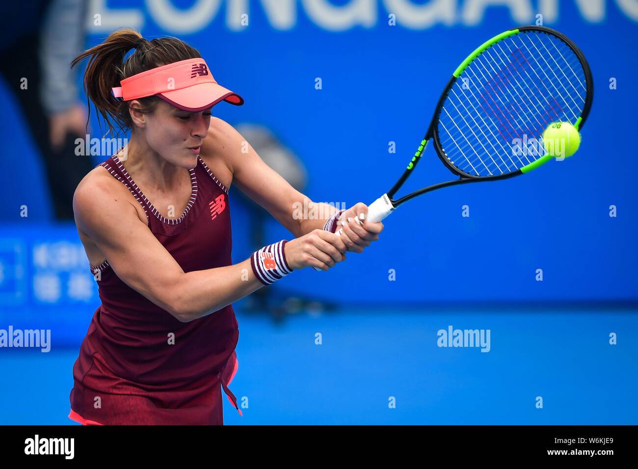 Nicole Gibbs of the United States returns a shot to Simona Halep of ...