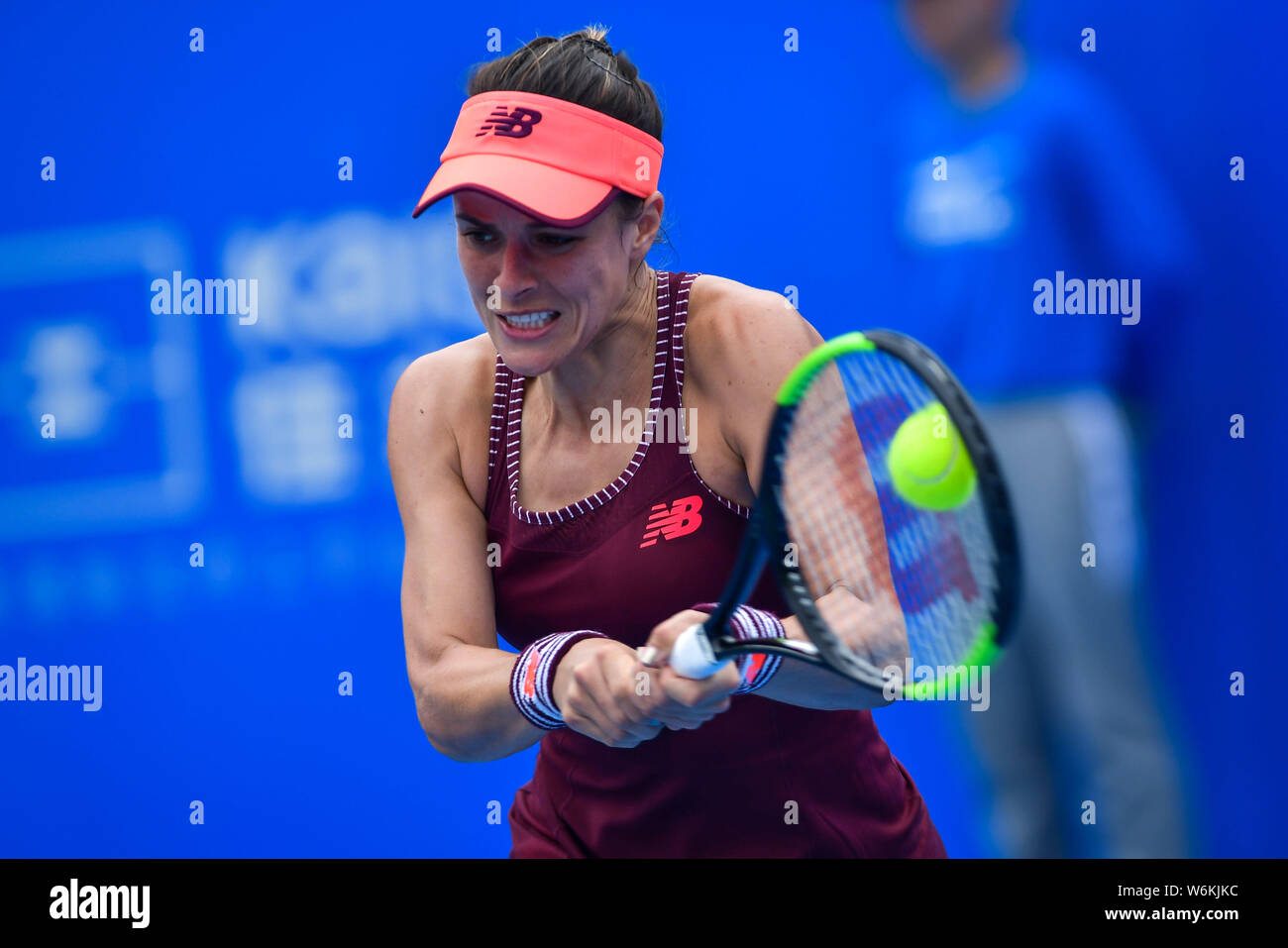 Nicole Gibbs of the United States returns a shot to Simona Halep of ...