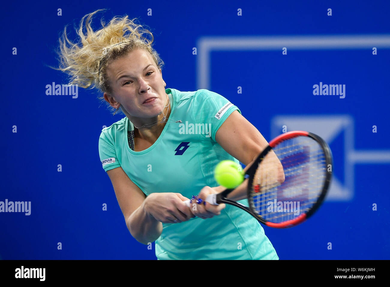Katerina Siniakova of Czech Republic returns a shot to Maria Sharapova ...