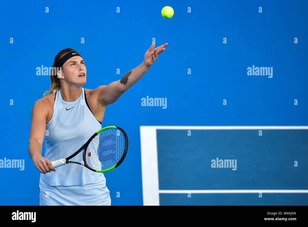 Simona Halep of Romania serves against Aryna Sabalenka of Belarus in ...