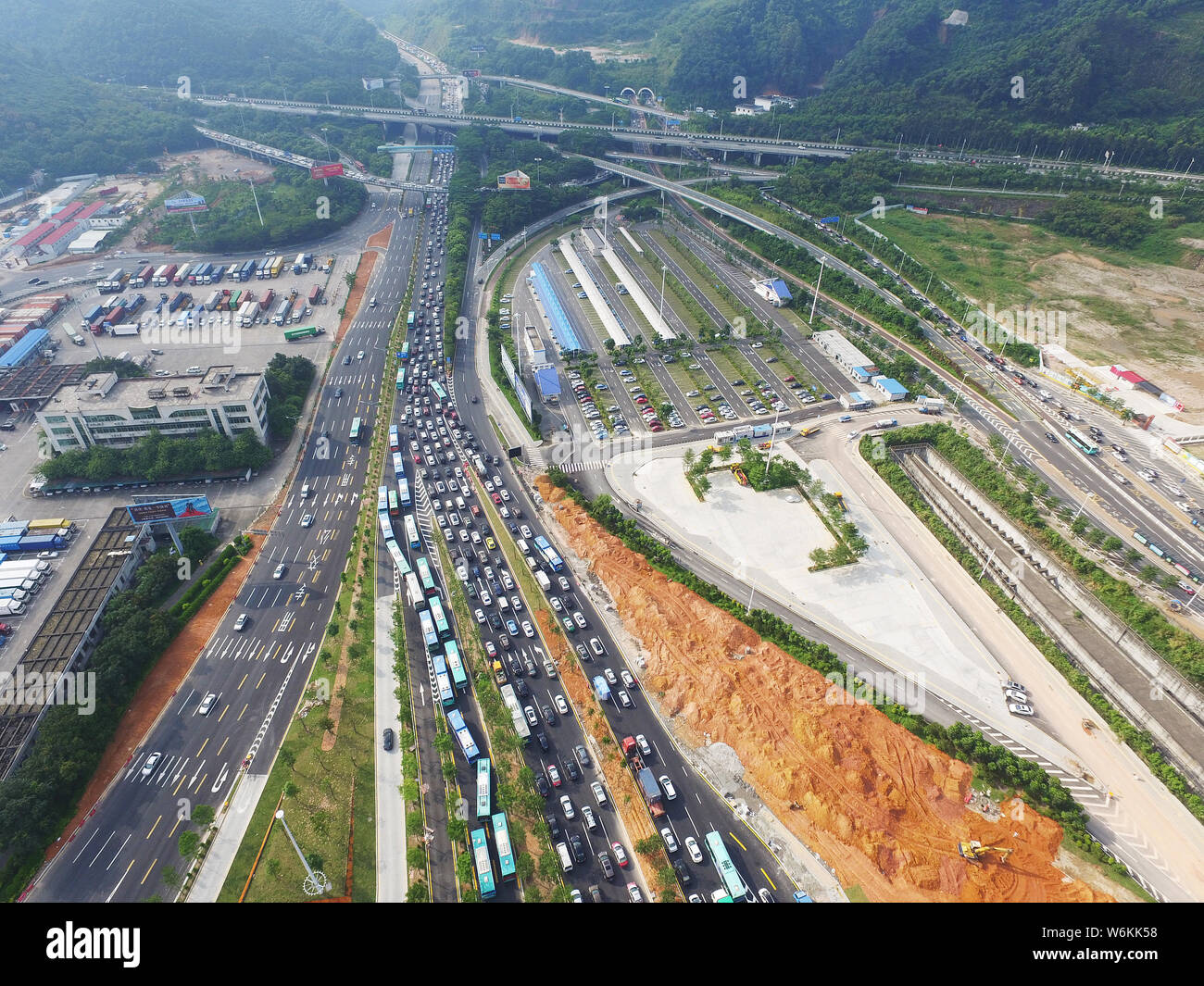 --FILE--Aerial view of masses of vehicles queuing up to pass the Meilin ...
