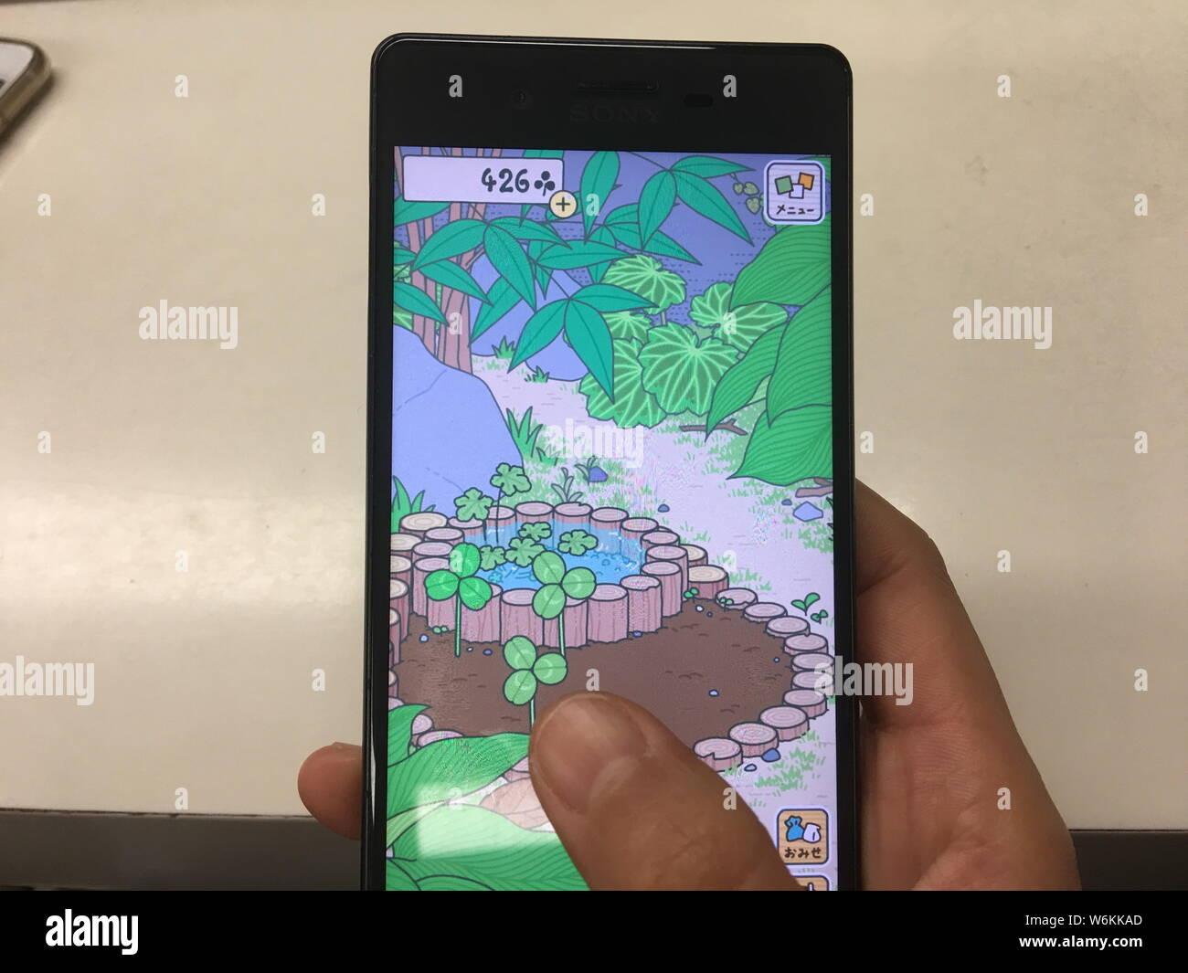 A Chinese player "raises" a frog as she plays mobile game "Tabi Kaeru ...