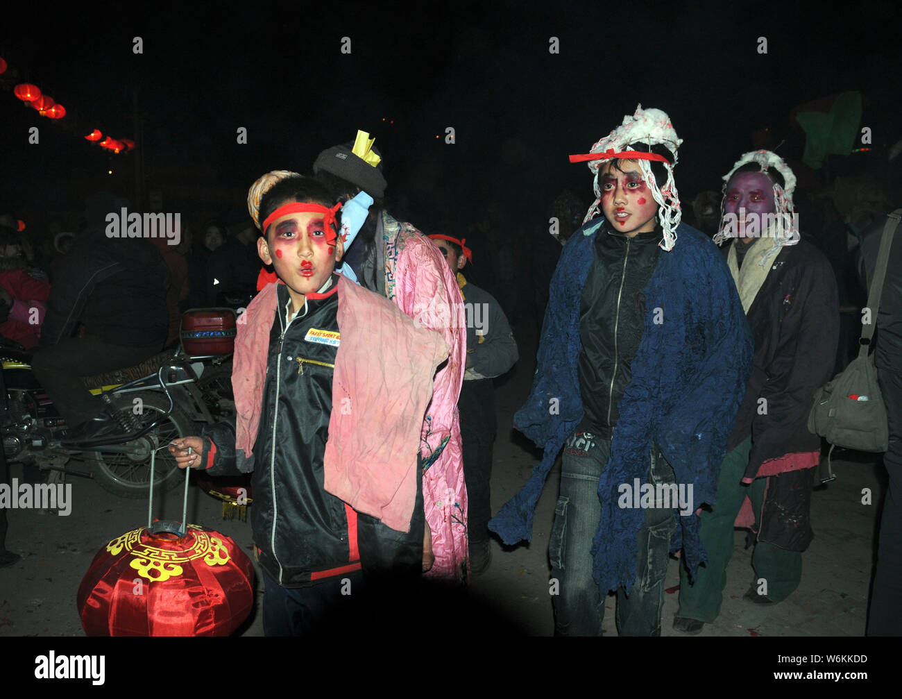 Chinese performers dressed in traditional costumes perform "Paomabi" or ...