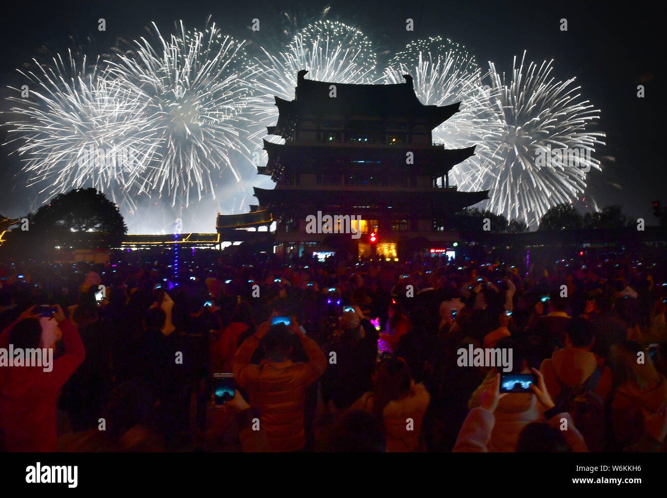 Visitors take photos of a firework show on New Year's Day at Orange ...