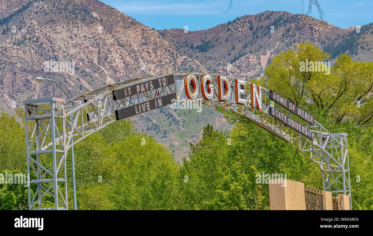 Panorama Welcome arch in Ogden Utah against lush trees towering ...