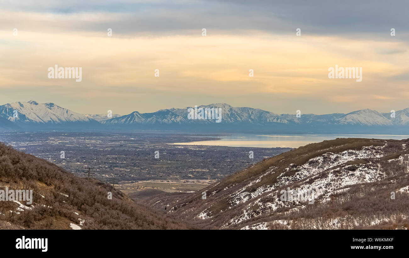 Panorama Lake and vast valley viewed from a mountain with trees and ...