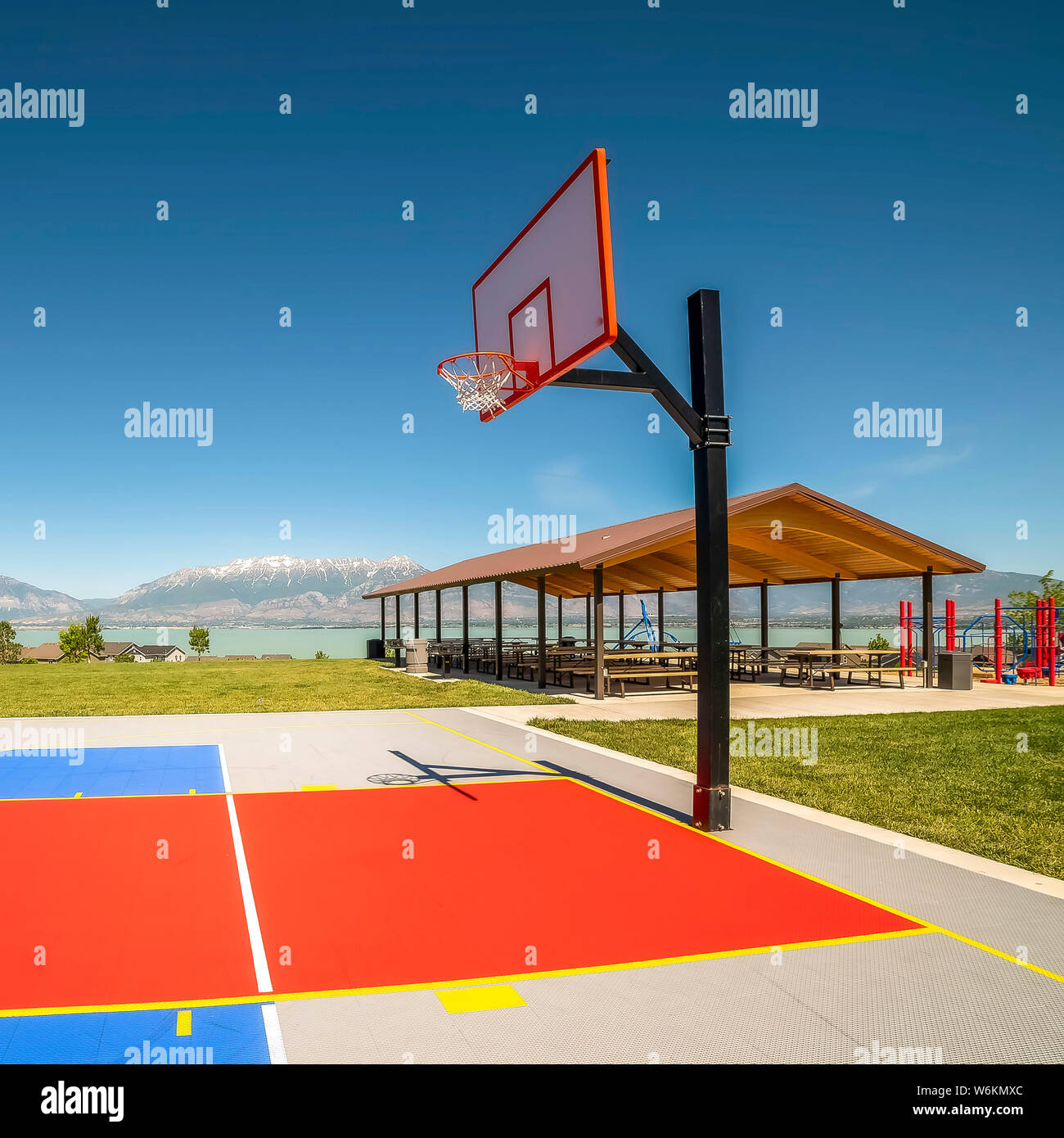 Square Park basketball court with childrens playground and picnic ...