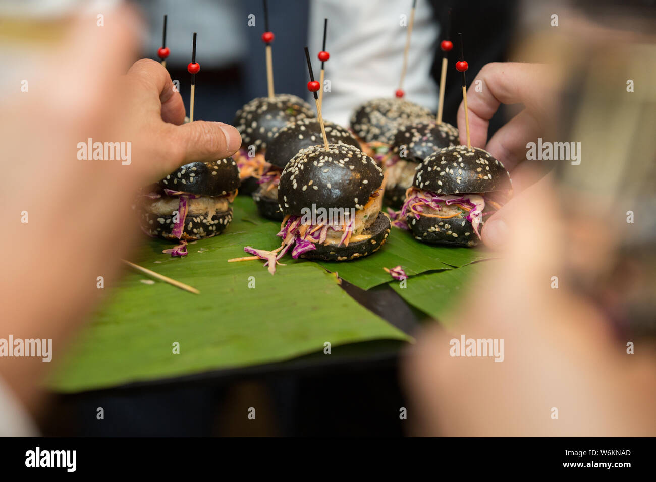 Mini burgers at a corporate event Stock Photo - Alamy