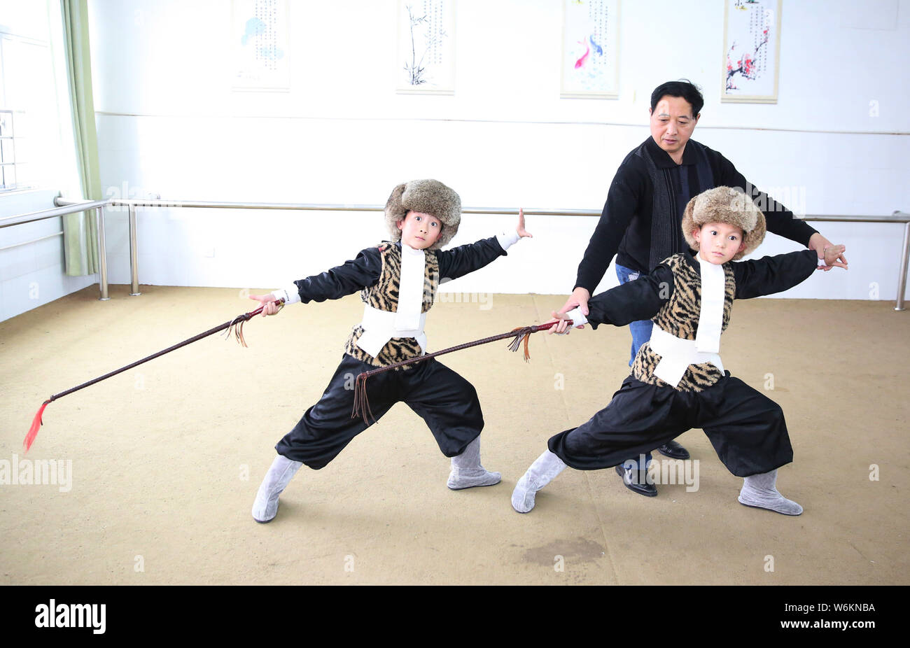Pupils from the Xichang Elementary School practise Chinese Beijing ...