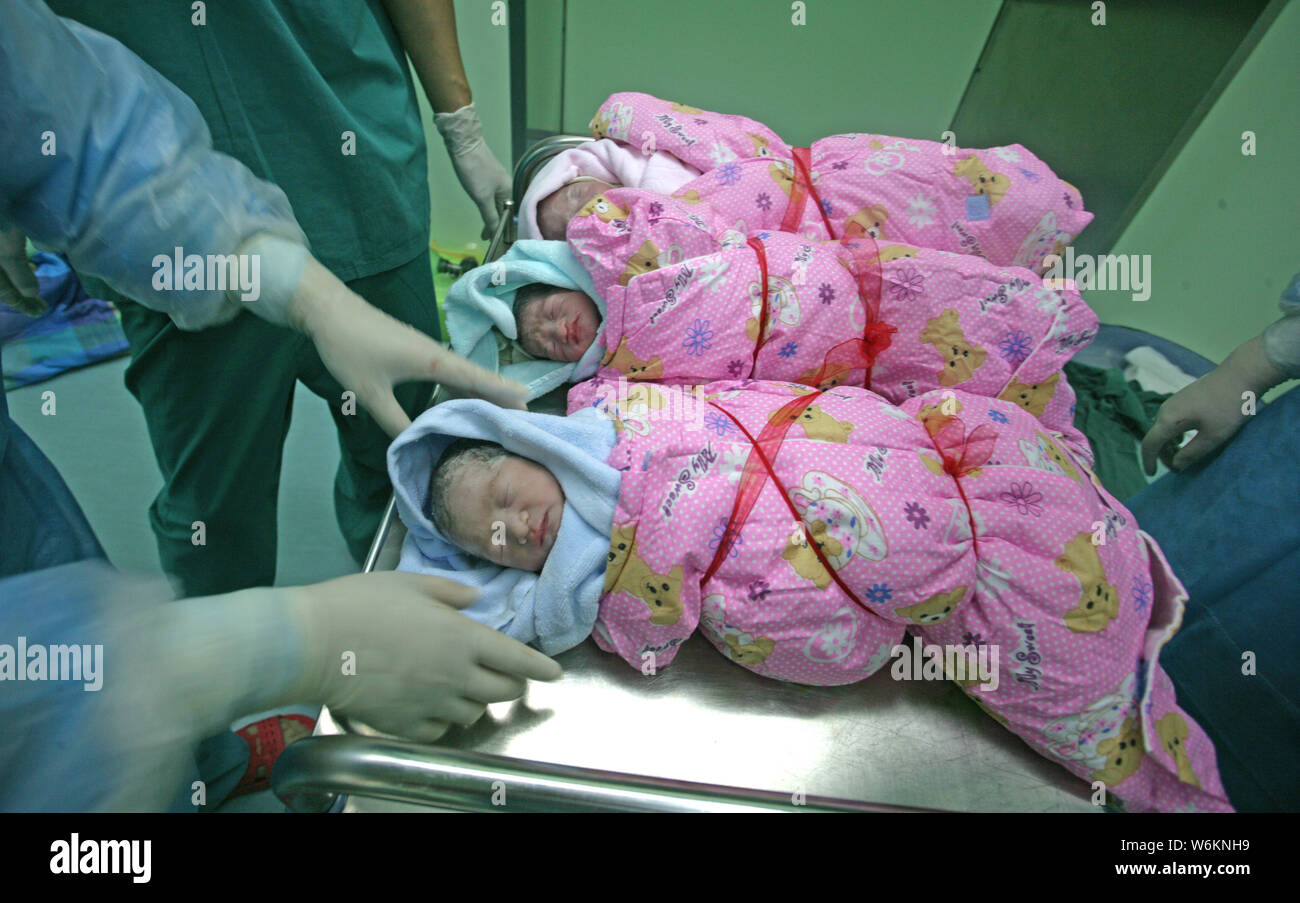 --FILE--The new born triplets are pictured in a hospital in Sanmenxia ...