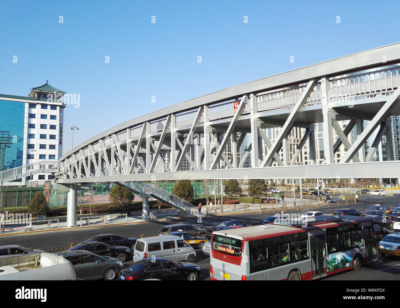 Vehicles drive under the newly-renovated Dongdan intersection, which is ...