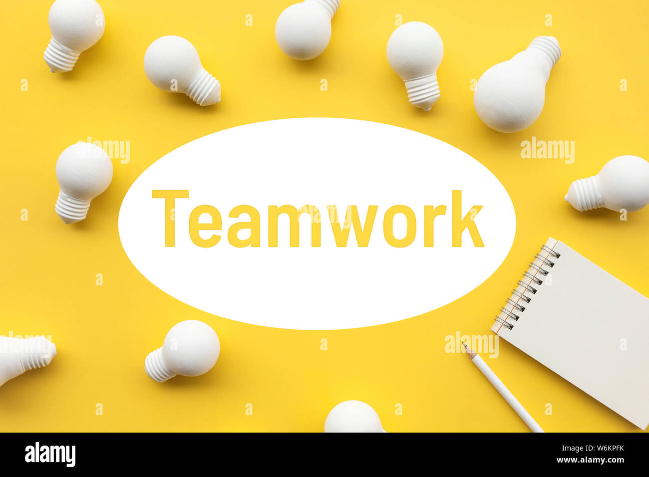 Teamwork concepts with group of lightbulb and notepad on pastel color ...