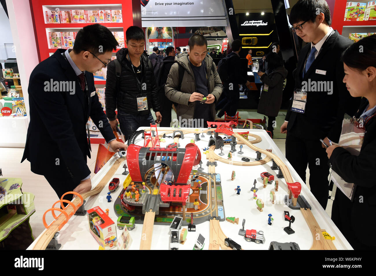 People look at a tracking model during the HKTDC Hong Kong Toys & Games ...