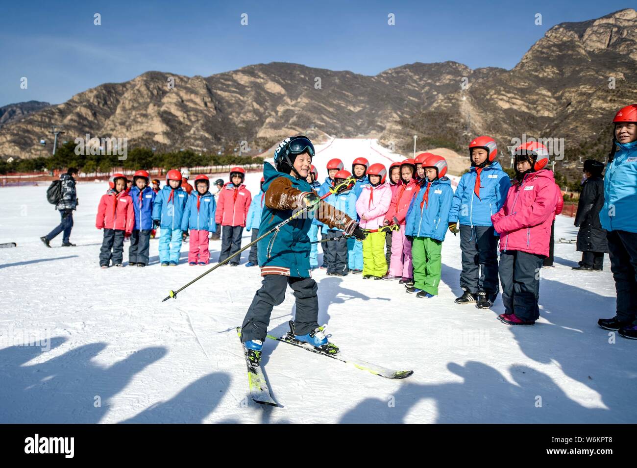 --FILE--A young Chinese boy shows off skiing skills during an ice and ...