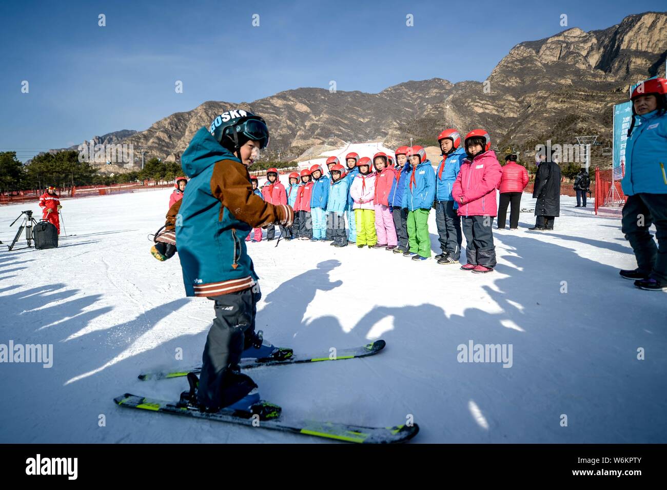 --FILE--A young Chinese boy shows off skiing skills during an ice and ...