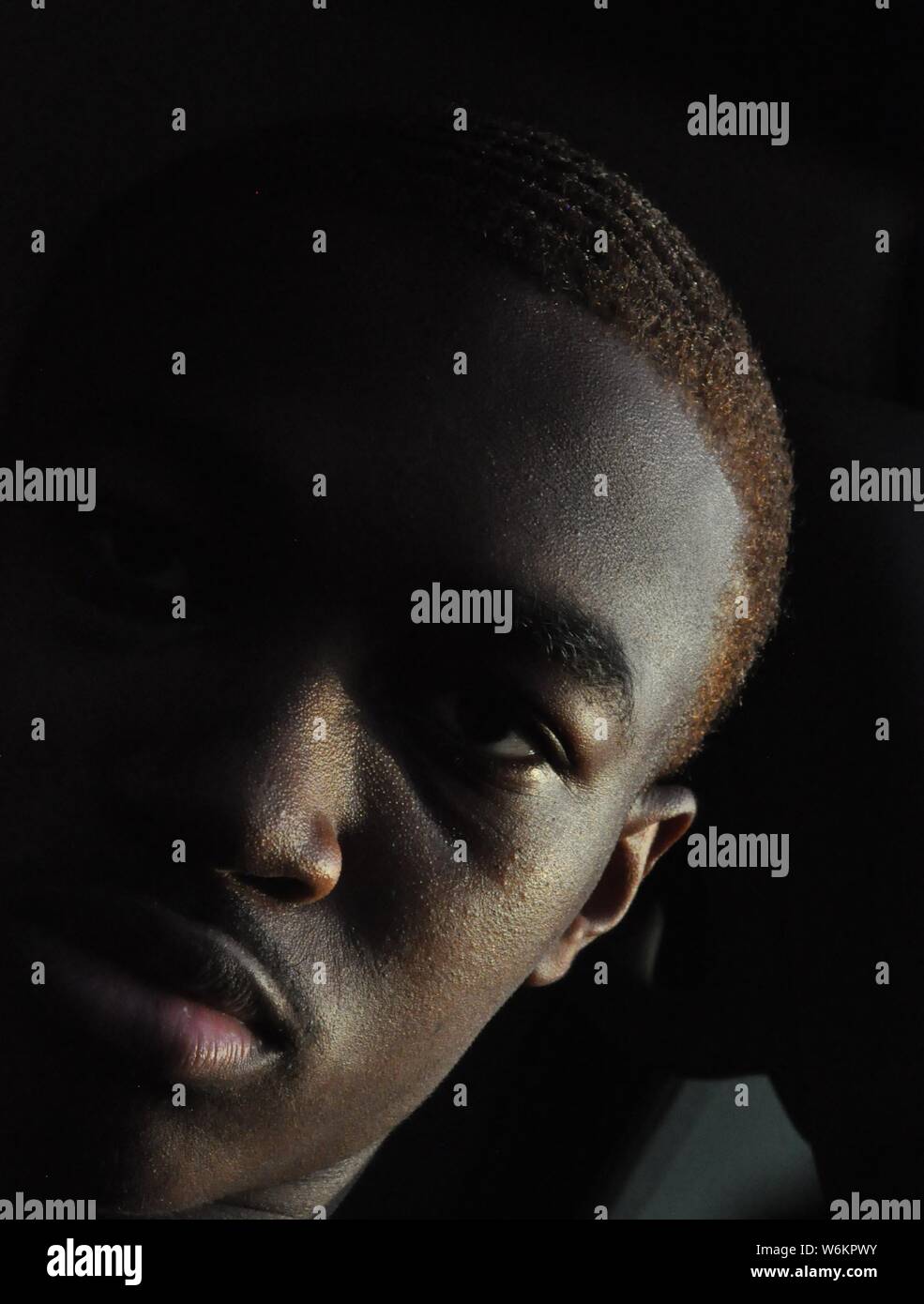 teen boy staring at the camera taking a picture Stock Photo - Alamy