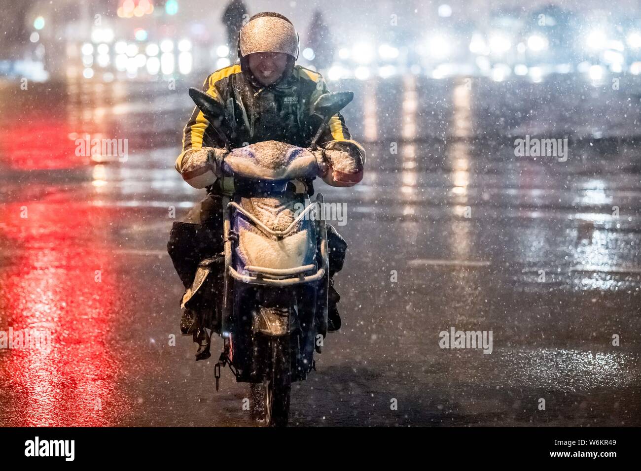 A food delivery courier of Chinese meal delivery company Meituan rides ... A food delivery courier of Chinese meal delivery company Meituan rides ...