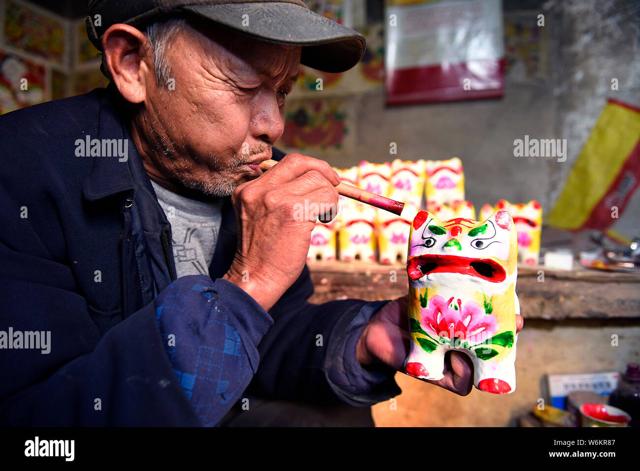 70-year-old Chinese craftsman Wei Zhaozhong makes the painted clay ...