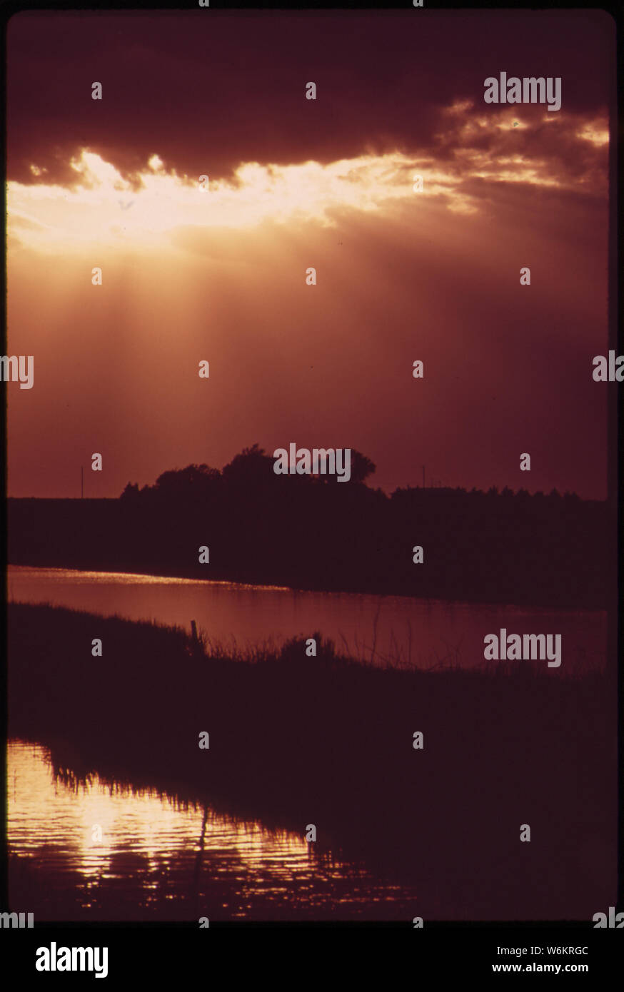 SUN RAYS THROUGH STORM CLOUDS OVER GRAFTON, IN THE AGRICULTURAL COUNTRY ...