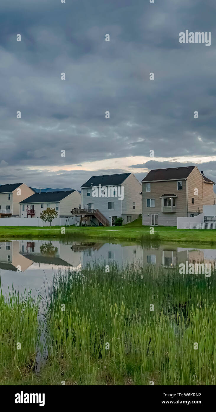 Vertical frame Overcast sky over a scenic neighborhood with lovely ...