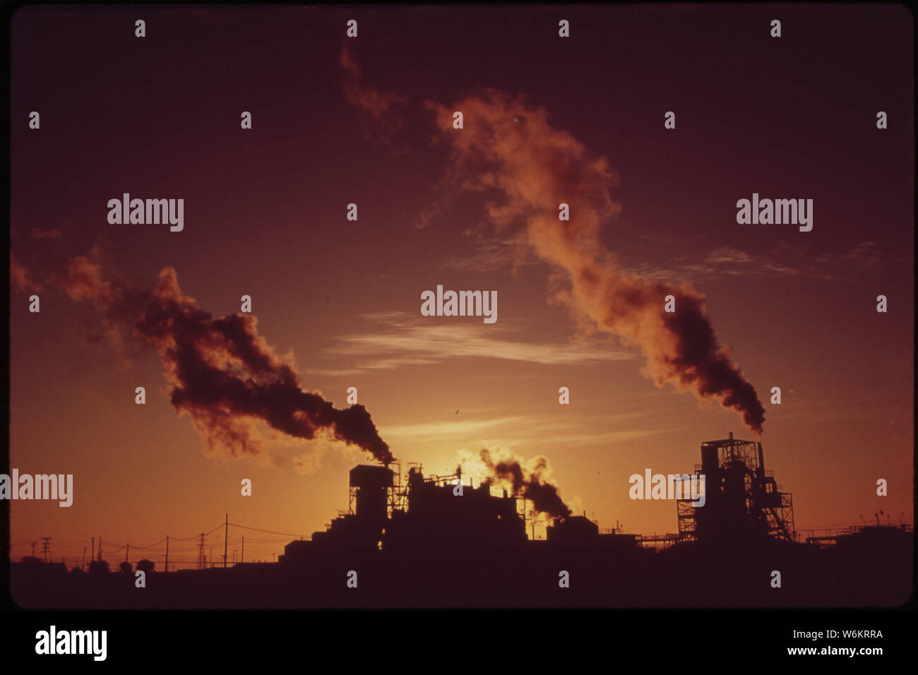 SUNSET AND SMOKE Stock Photo - Alamy