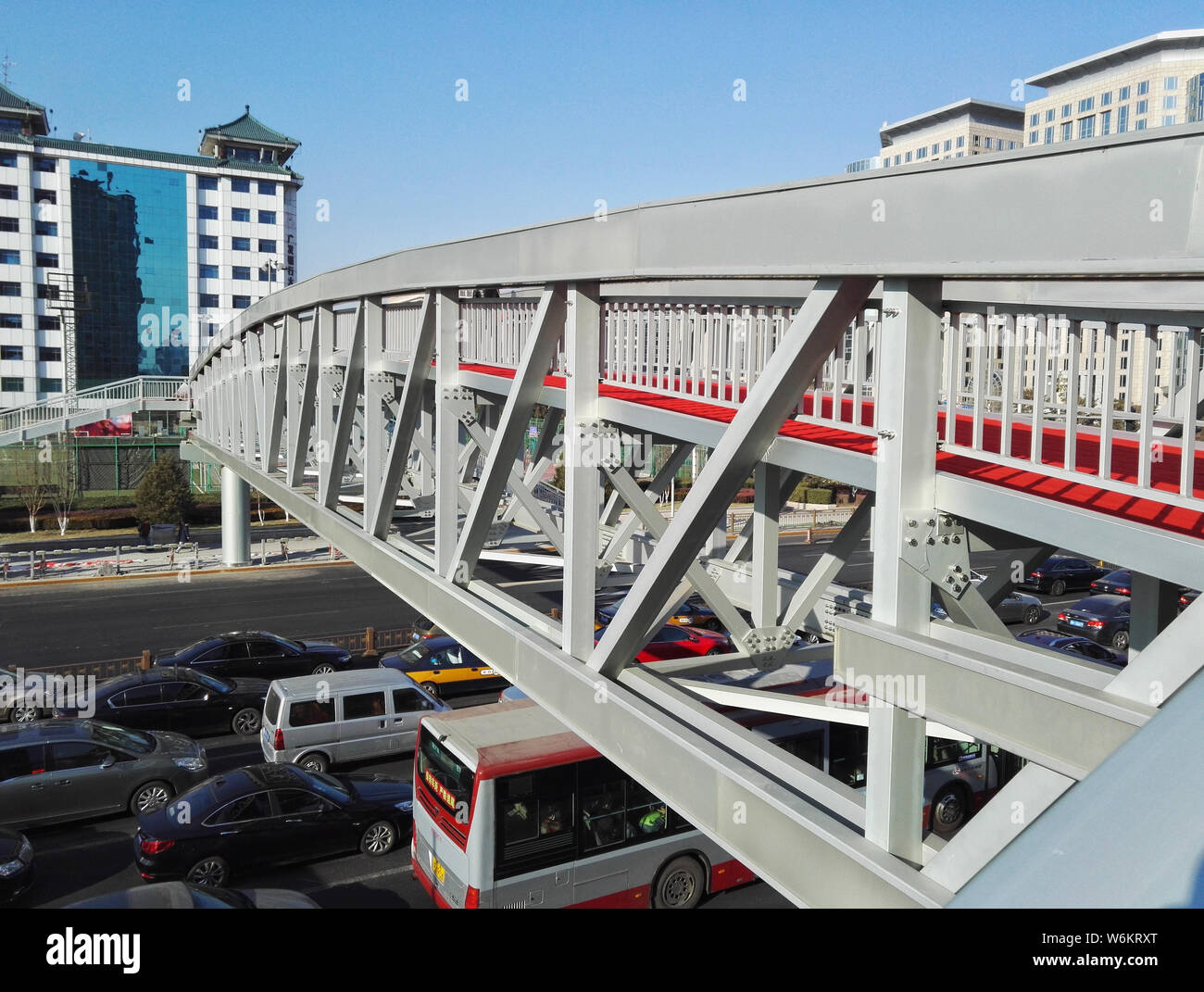 Vehicles drive under the newly-renovated Dongdan intersection, which is ...