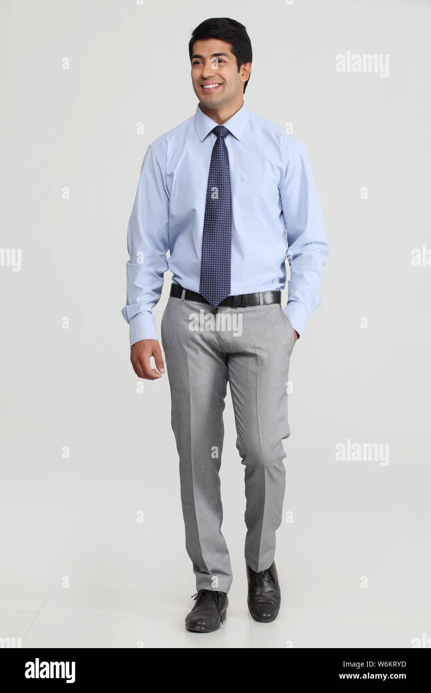 Man walking hands in pockets hi-res stock photography and images - Alamy